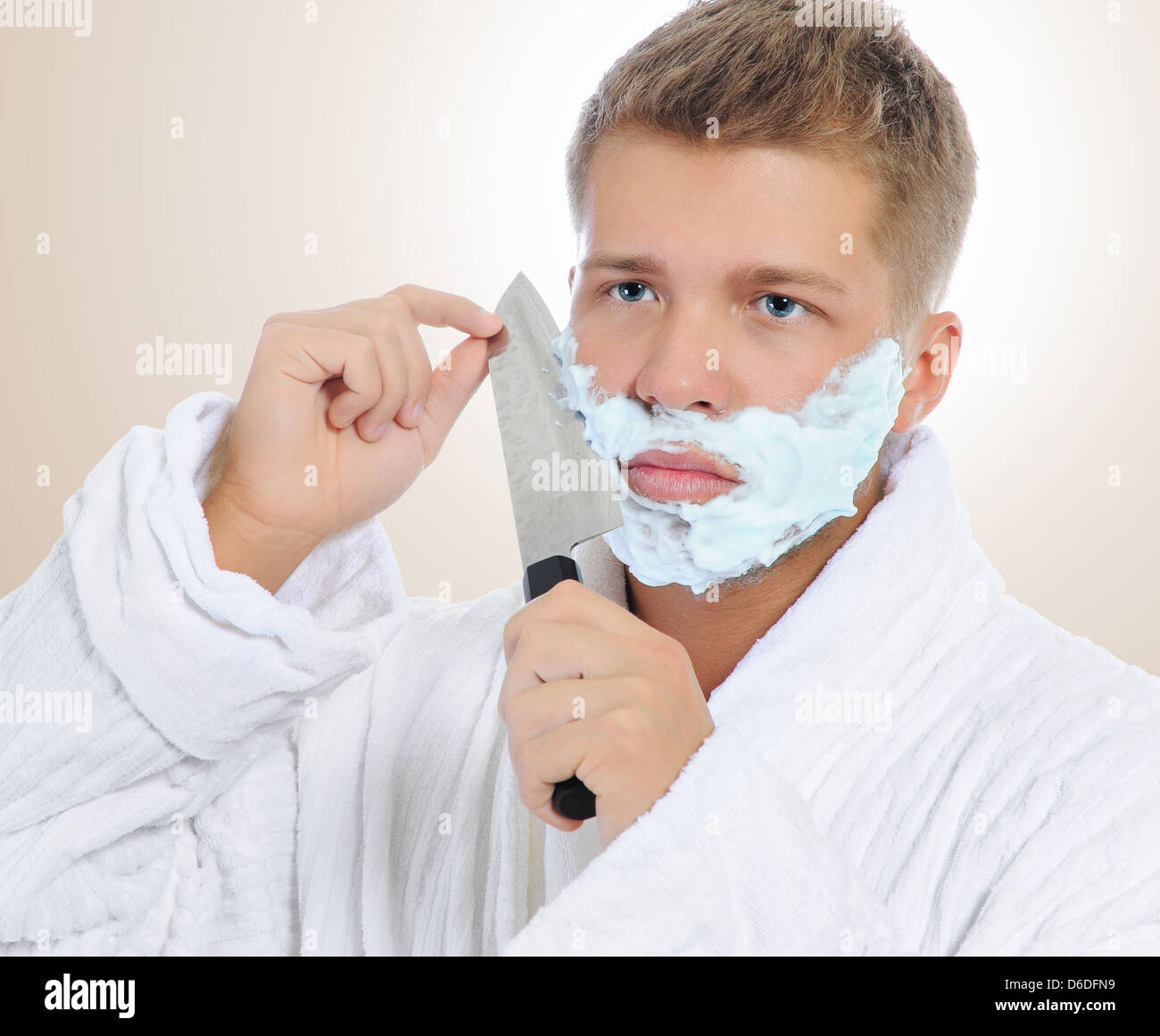 Young man shaving Stock Photo - Alamy