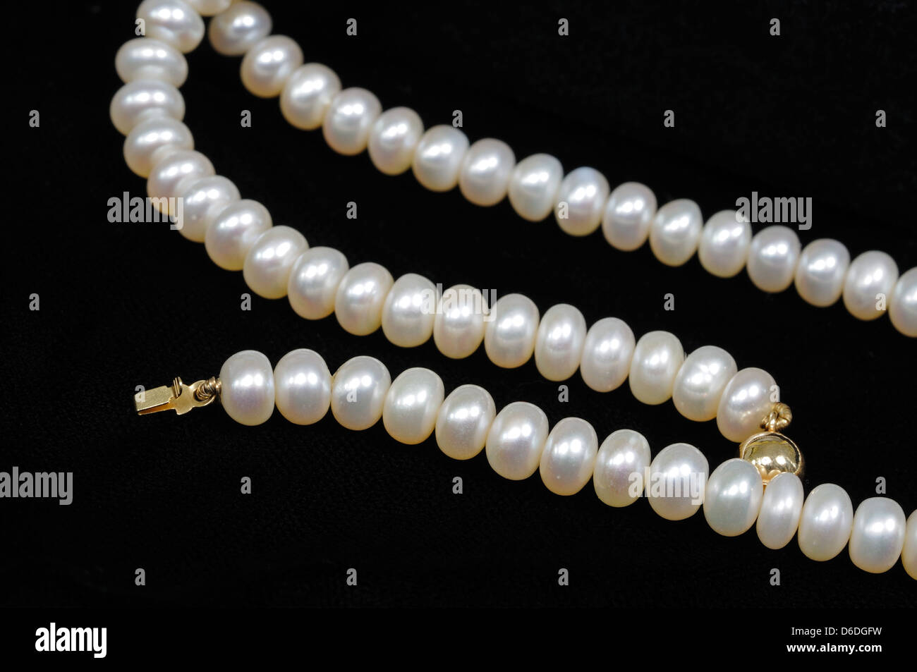 Cultivated pearl necklace against a black background Stock Photo - Alamy