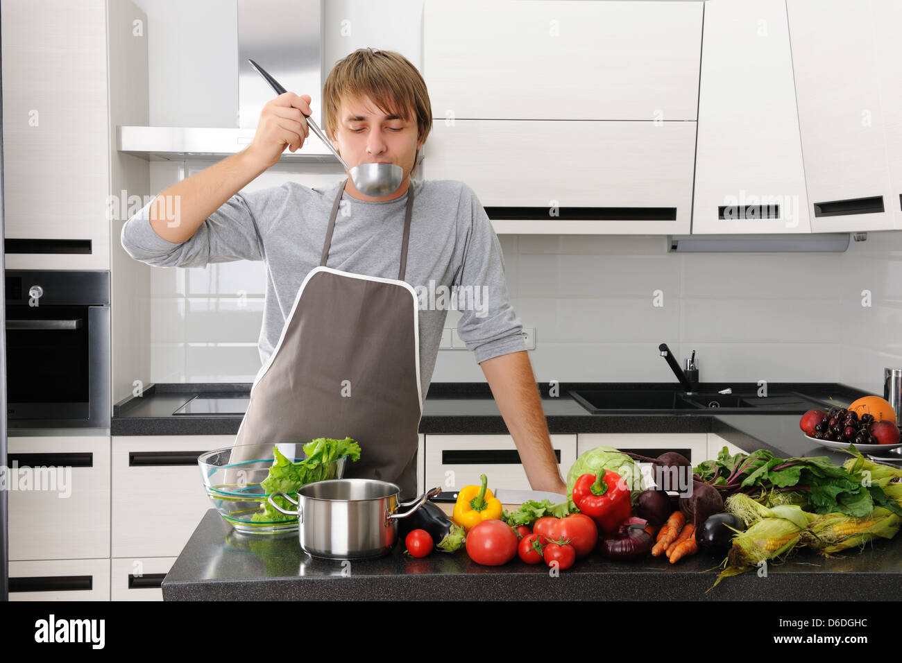 Man in kitchen Stock Photo - Alamy