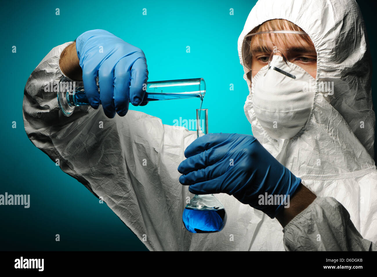 Scientist pouring liquid measuring beaker hi-res stock photography and ...