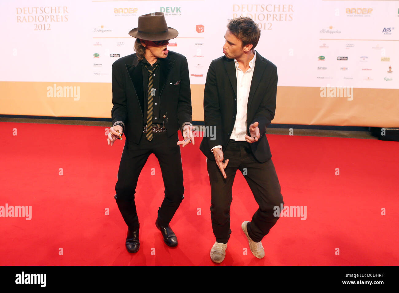 German singer Udo Lindenberg (L) and Clueso dance on the red carpet ...