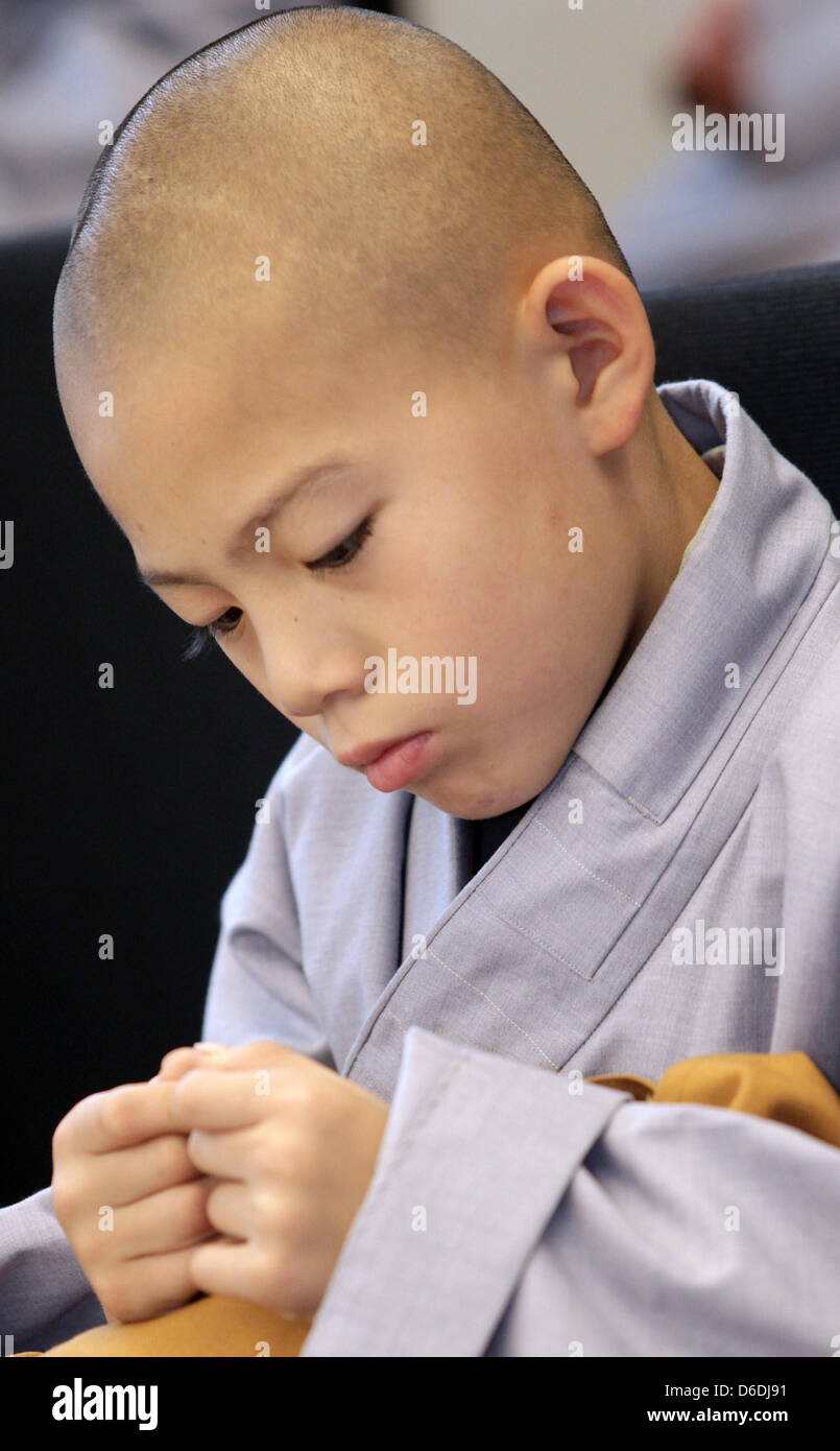 A young Chinese Shaolin monk attends a press conference held at the ...