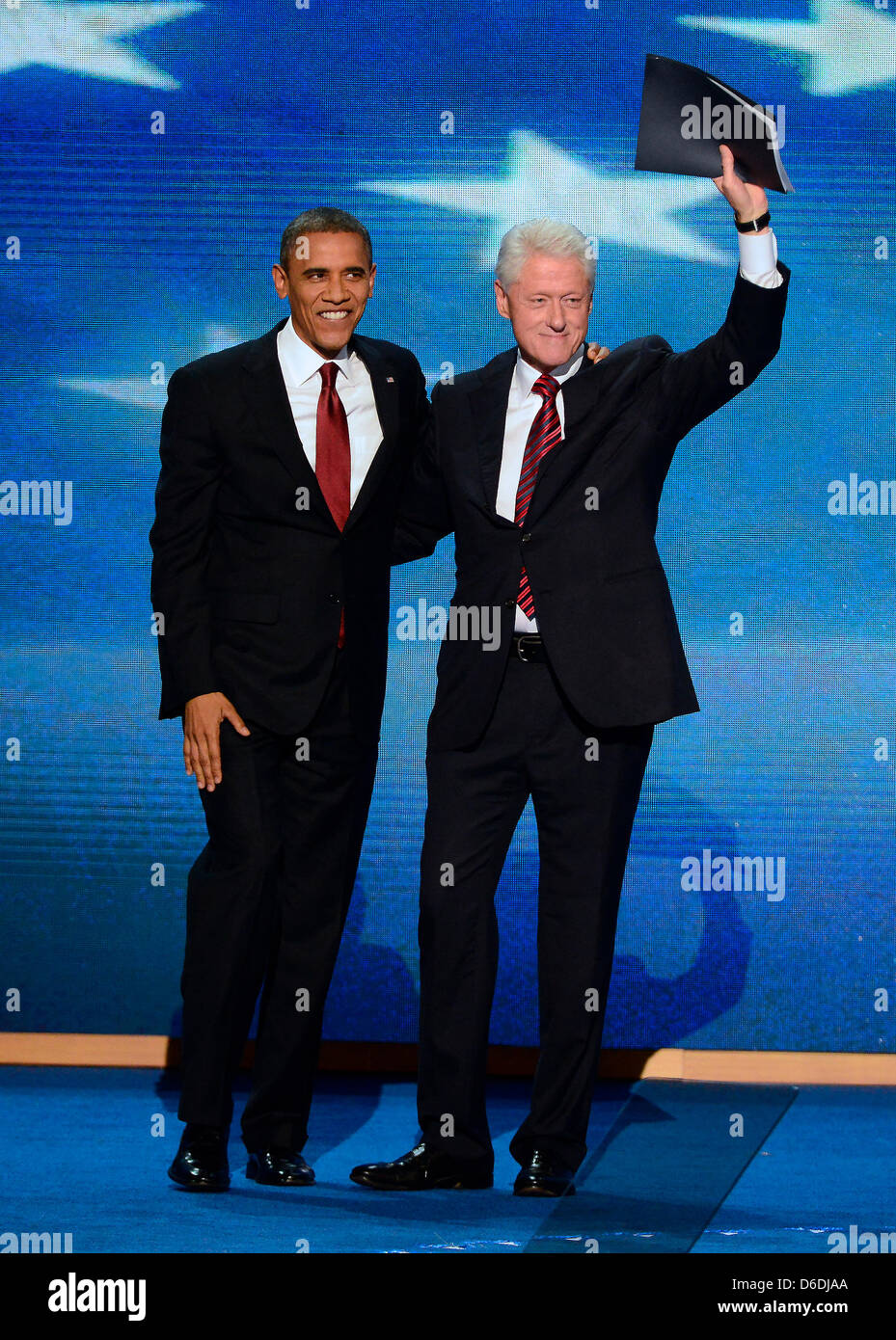 Former United States President Bill Clinton hugs U.S. President Barack ...
