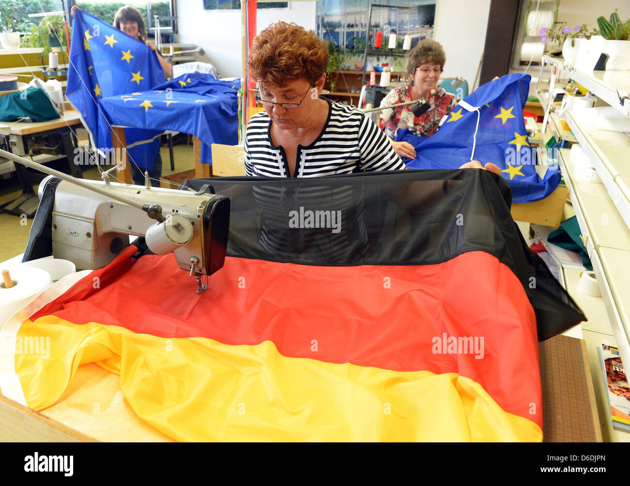 ILLUSTRATION - An illustrated picture shows employees of flag ...