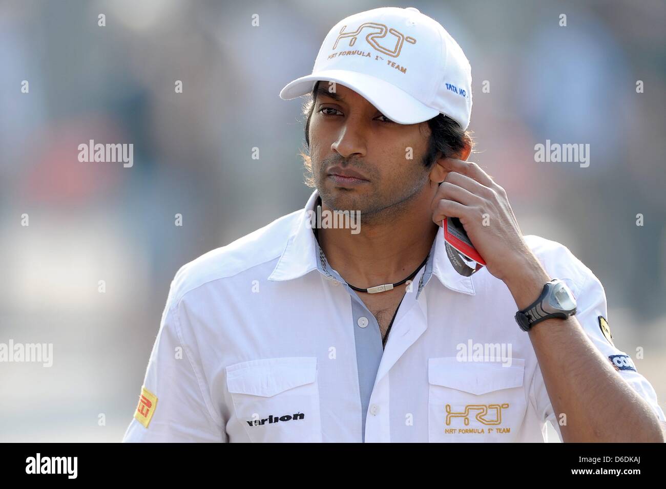 Indian Formula One driver Narain Karthikeyan of HRT arrives the paddock ...