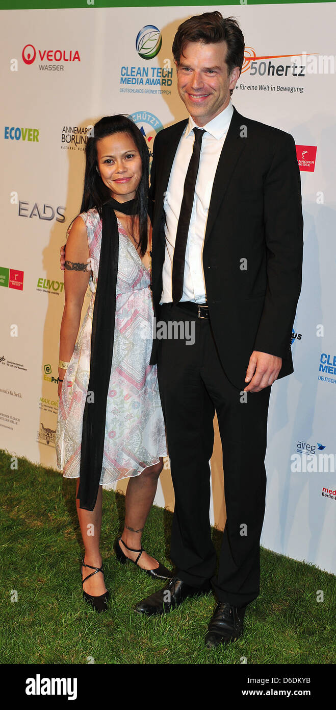 Actor Johannes Brandrup (R) and his partner Mary Ann Zarate pose on the ...