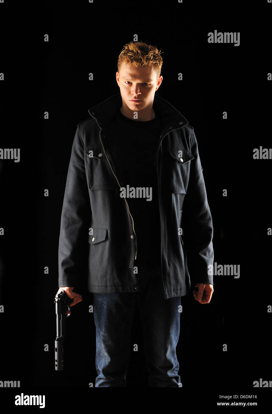 Man with gun Stock Photo - Alamy