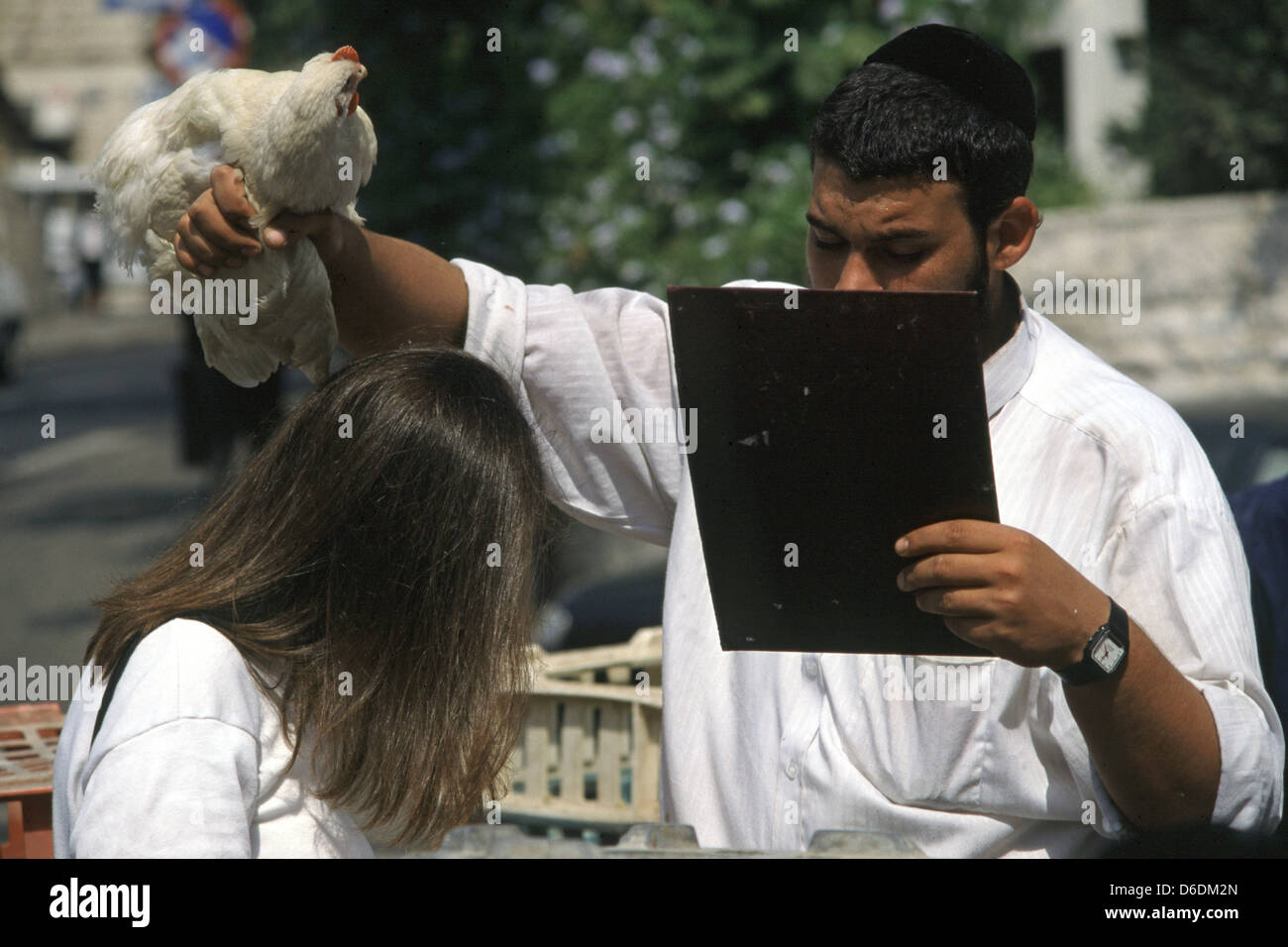 Woman slaughtering chicken hi-res stock photography and images - Alamy
