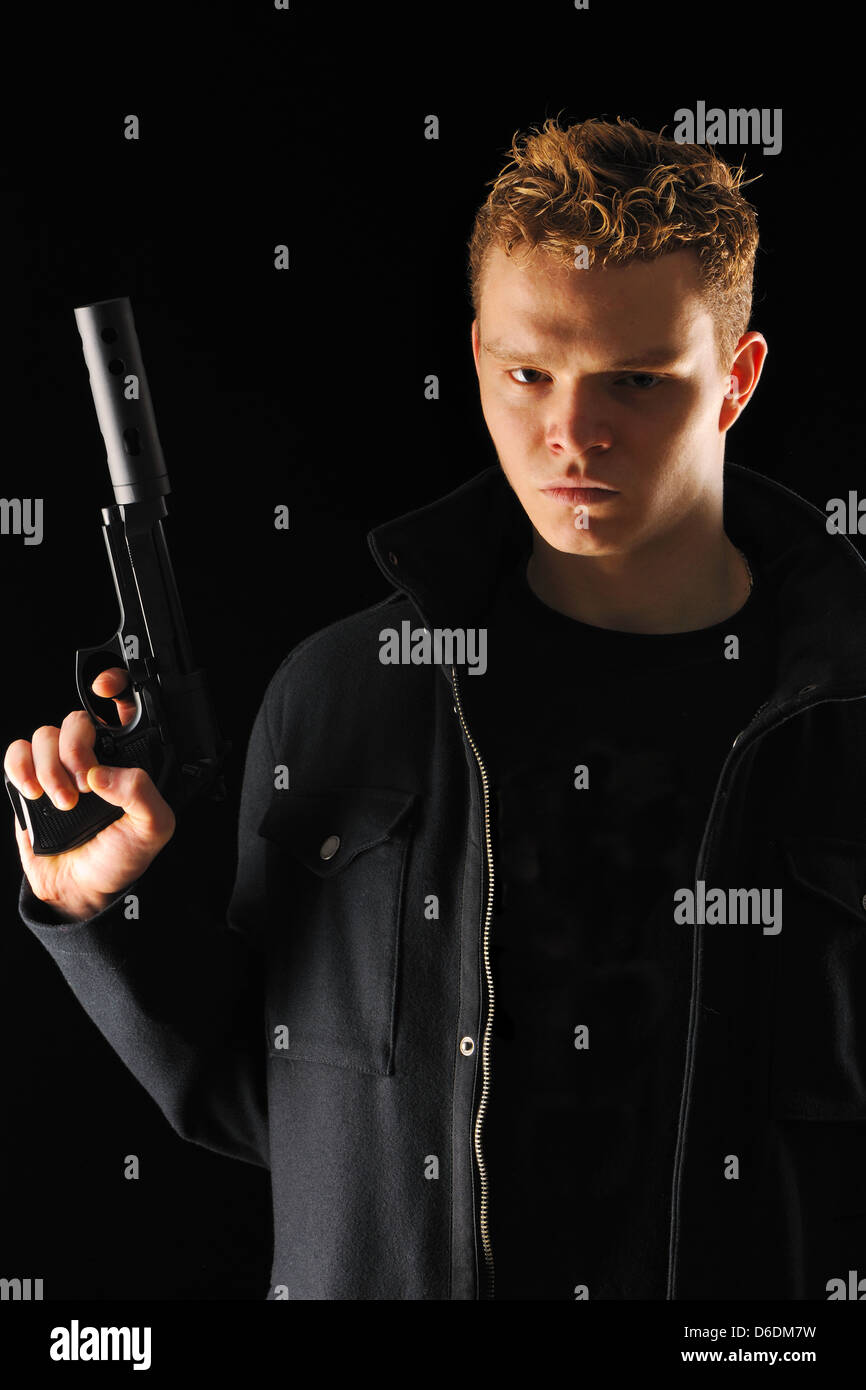 Man with gun Stock Photo - Alamy