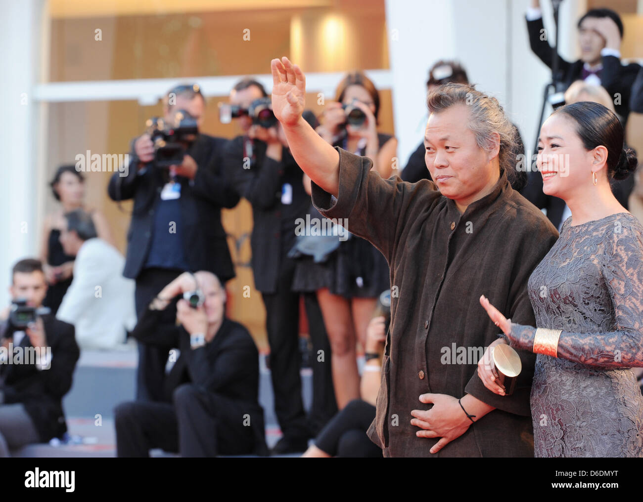 Director Kim Ki-duk and actress Cho Min-soo arrive for the award ...