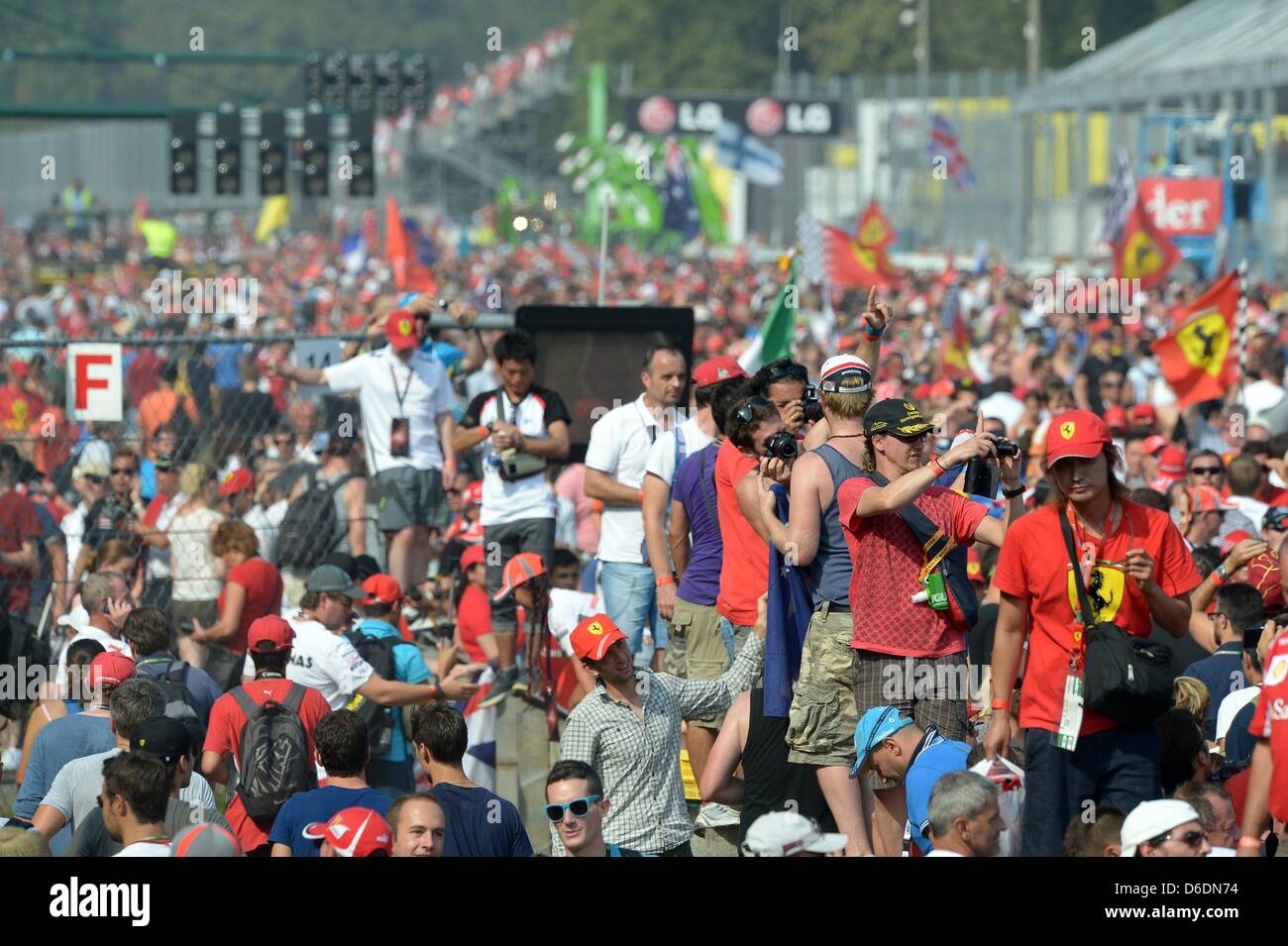Fans enter the track after the 2012 Italian Formula One Grand Prix at ...