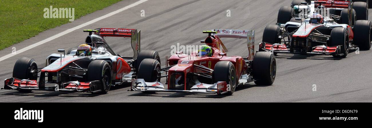 Brazilian Formula One driver Felipe Massa (R) of Ferrari tries to ...