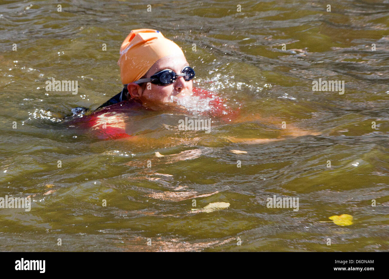 Dutch Princess Maxima swims through the canals of Amsterdam, The ...
