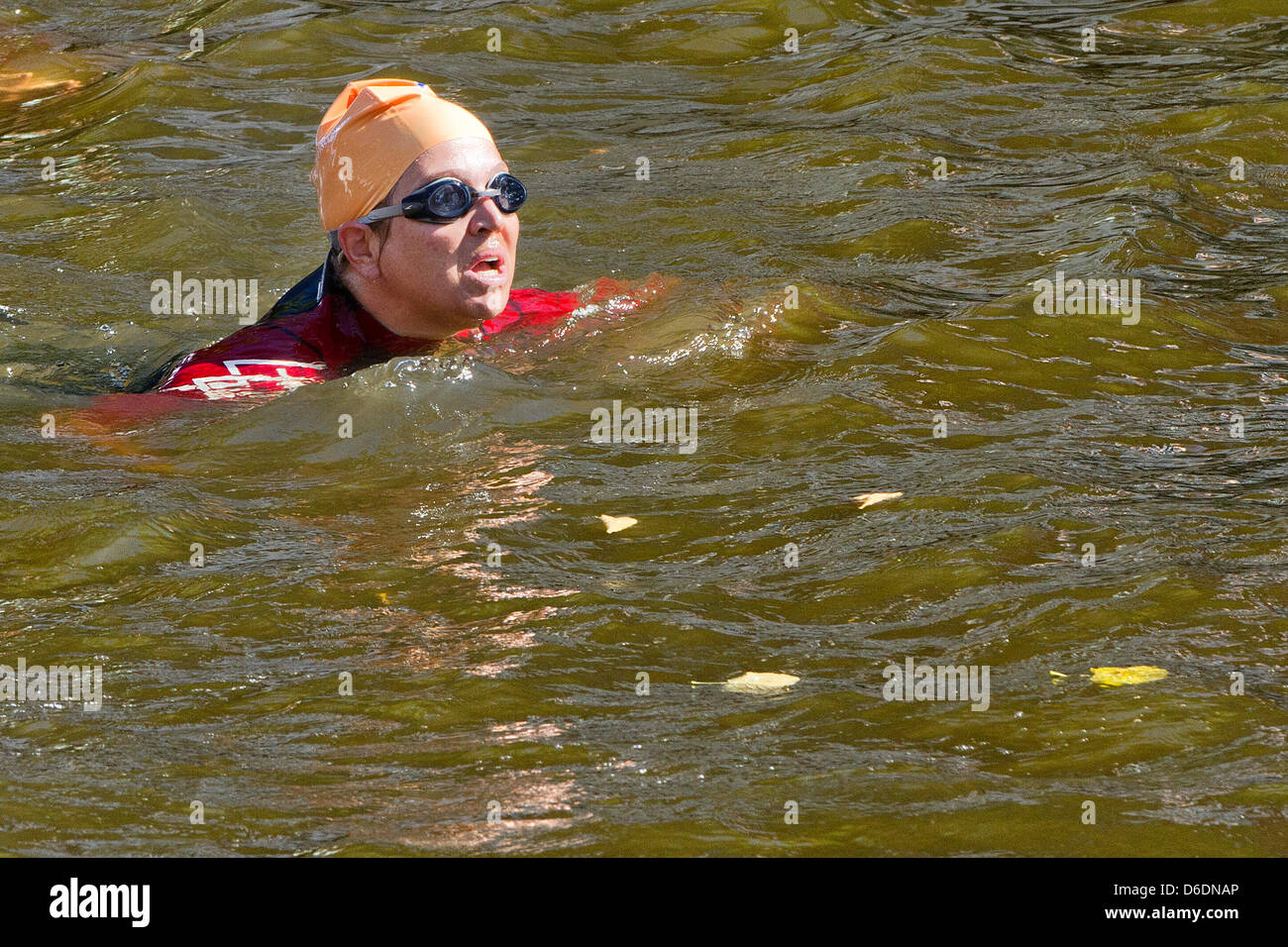 Dutch Princess Maxima swims through the canals of Amsterdam, The ...