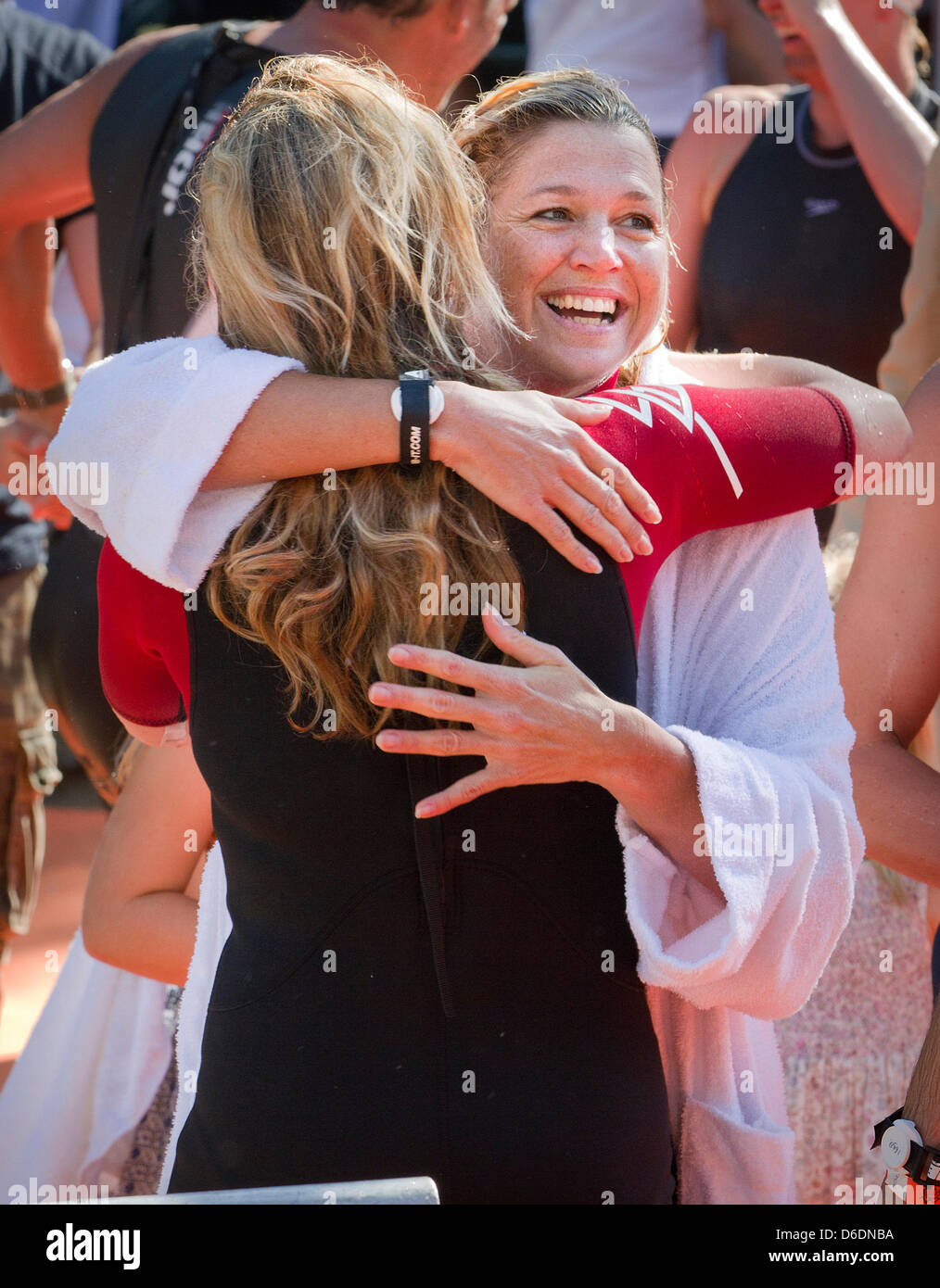 Dutch Princess Maxima (R) is welcomed back on solid ground after ...
