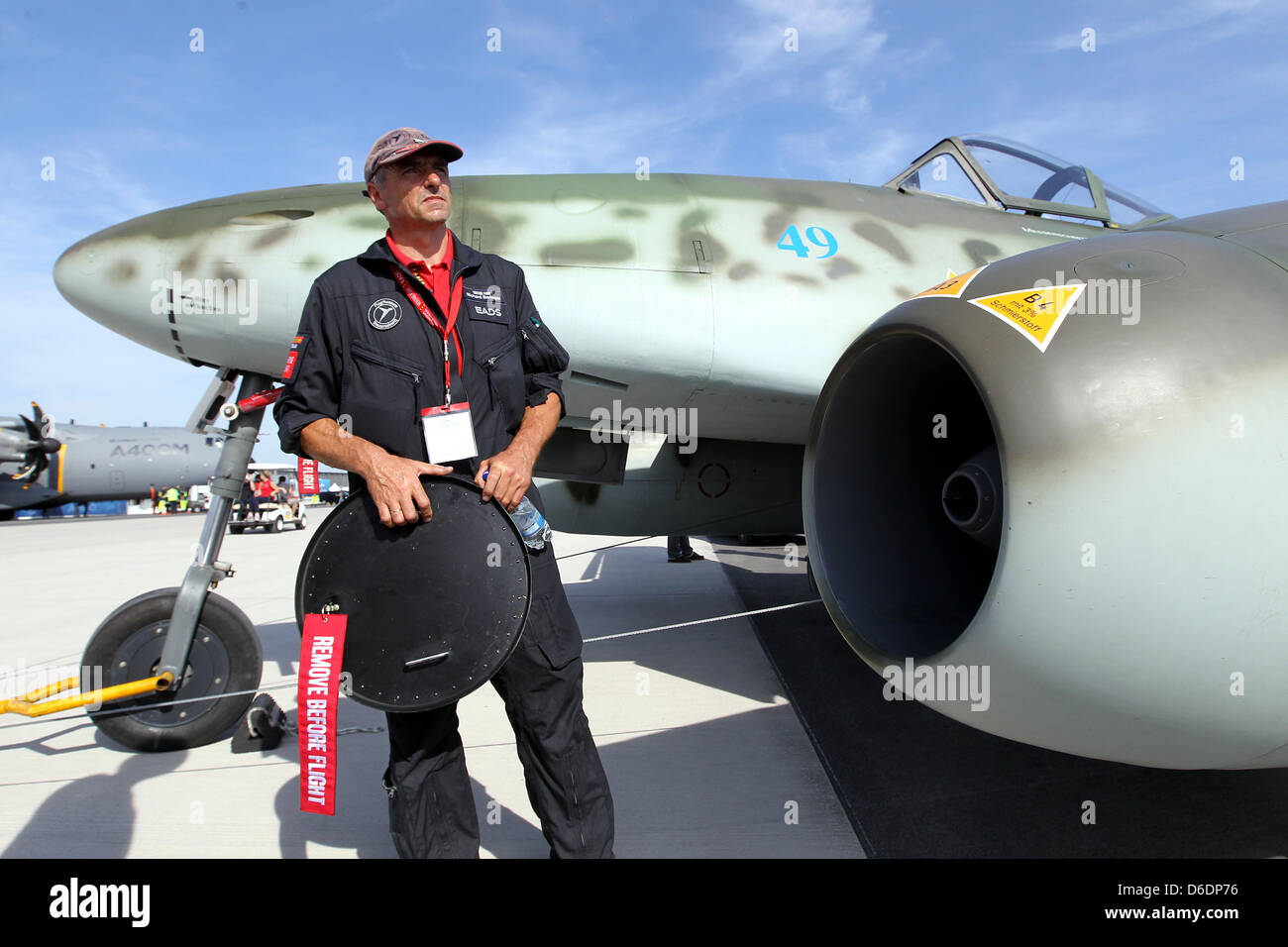 Pilot Richard Behringer stands next to a replica of a Messerschmidt ME ...