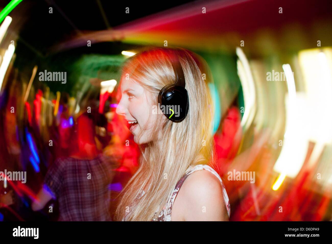 Eva dances during a headphone party at the Club Ullrich in Bochum ...