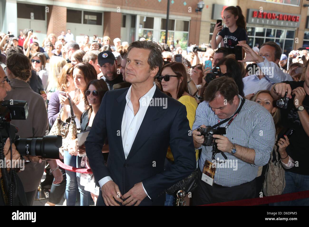Actor Colin Firth arrives at the premiere of the movie "Arthur Newman ...