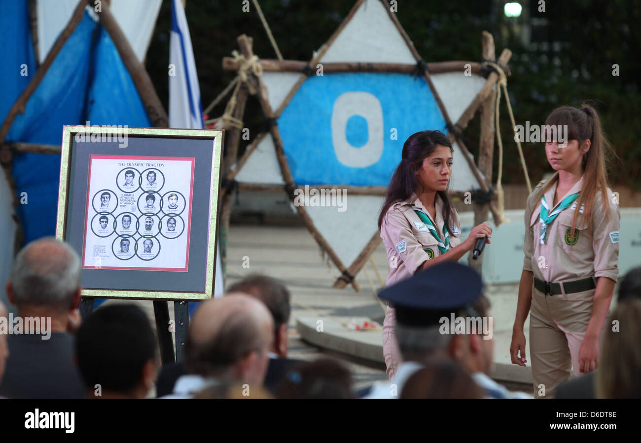 Young Israeli pathfinders sing a song of mourning next to the the ...