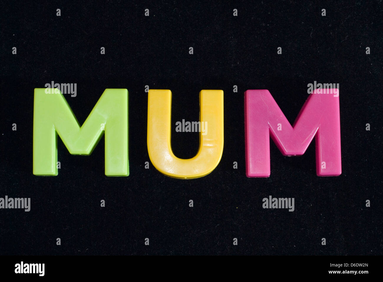 Mum written with childrens' toy colourful magnetic letters isolated on ...