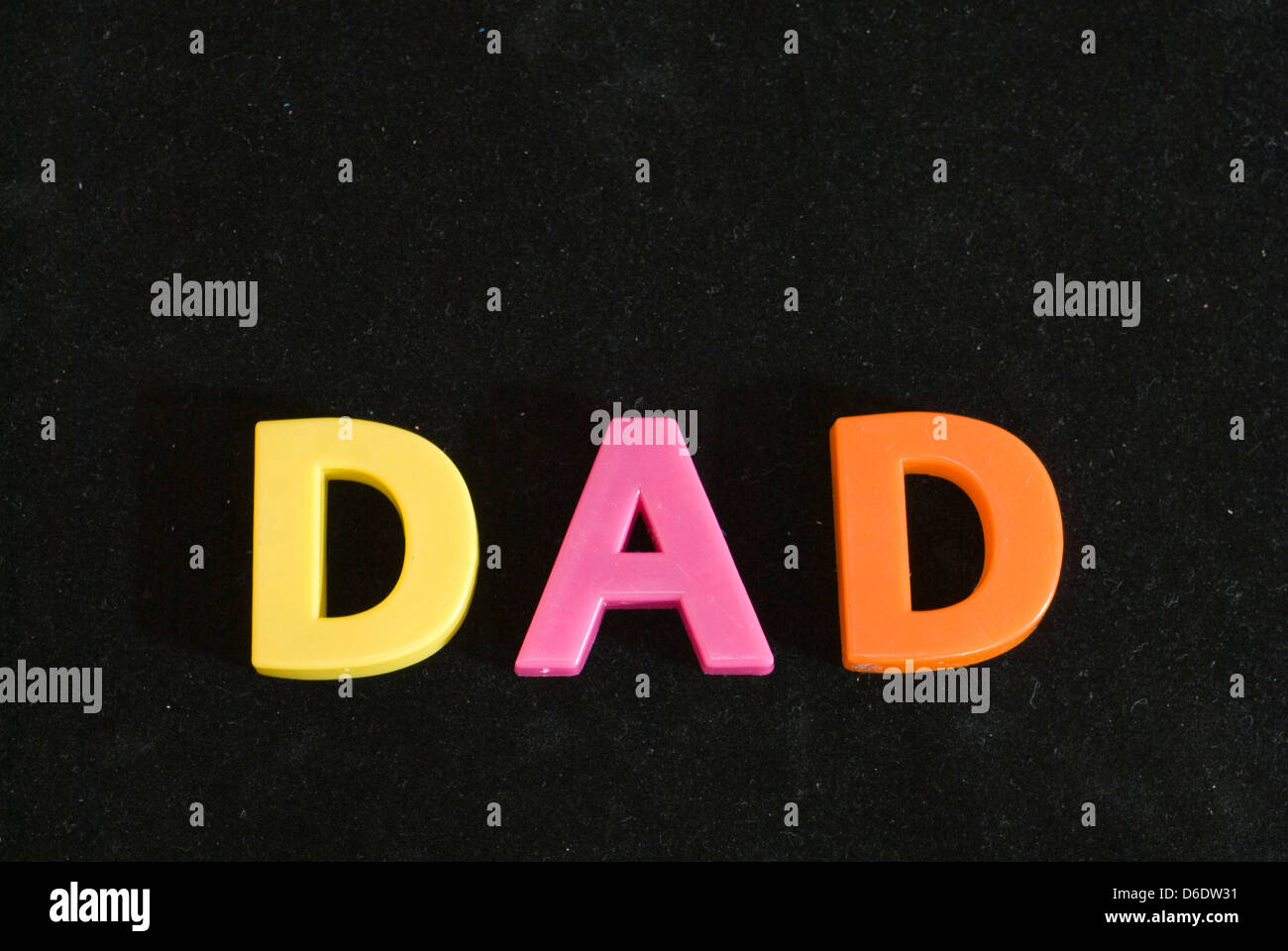 Dad written with children's toy colourful magnetic letters isolated on ...