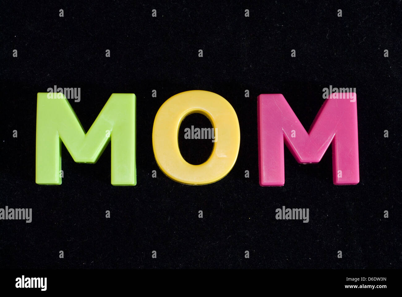 Mom written with children's toy colourful magnetic letters isolated on ...