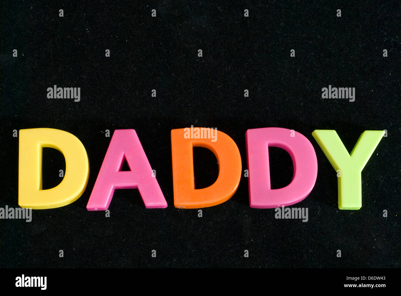 Daddy written with children's toy colourful magnetic letters isolated ...