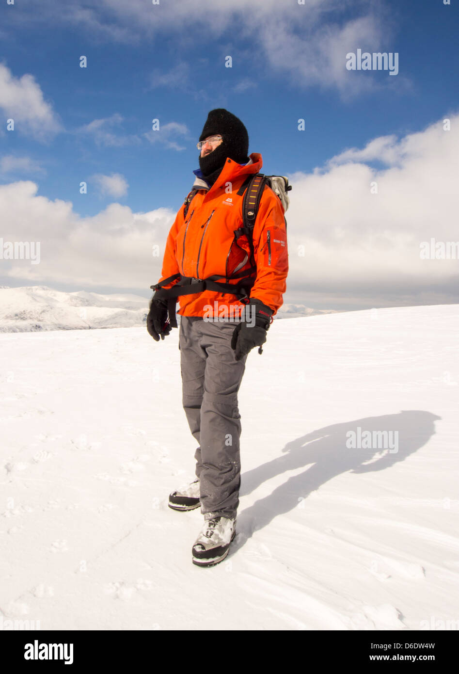 A walker on High Street in unseasonally cold weather in late March 2013 ...
