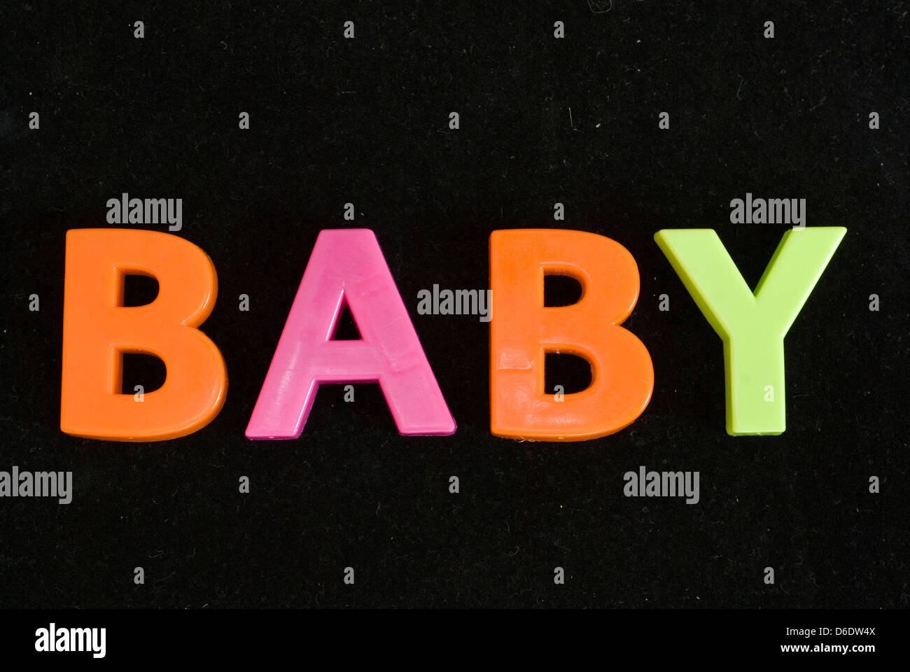 Baby written with children's toy colourful magnetic letters isolated on ...