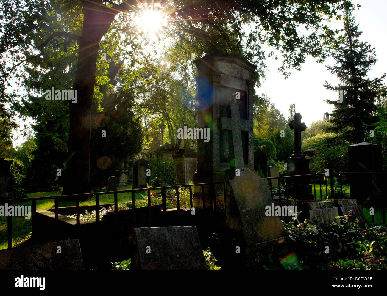 The sun shines on old graves at the Trinitatis cemetery in Dresden ...
