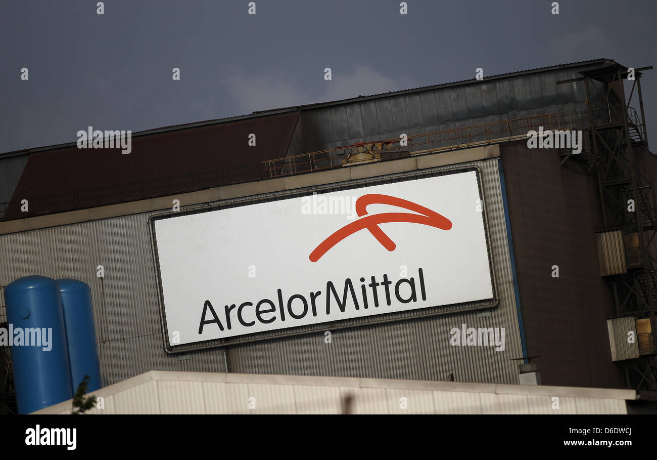 The company logo hangs at the ArcelorMittal steel factory in Hamburg ...