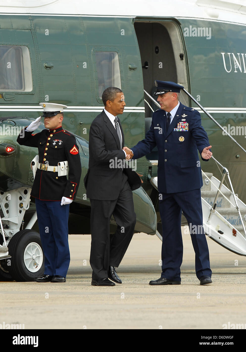 United States President Barack Obama is greeted by Colonel Michael ...