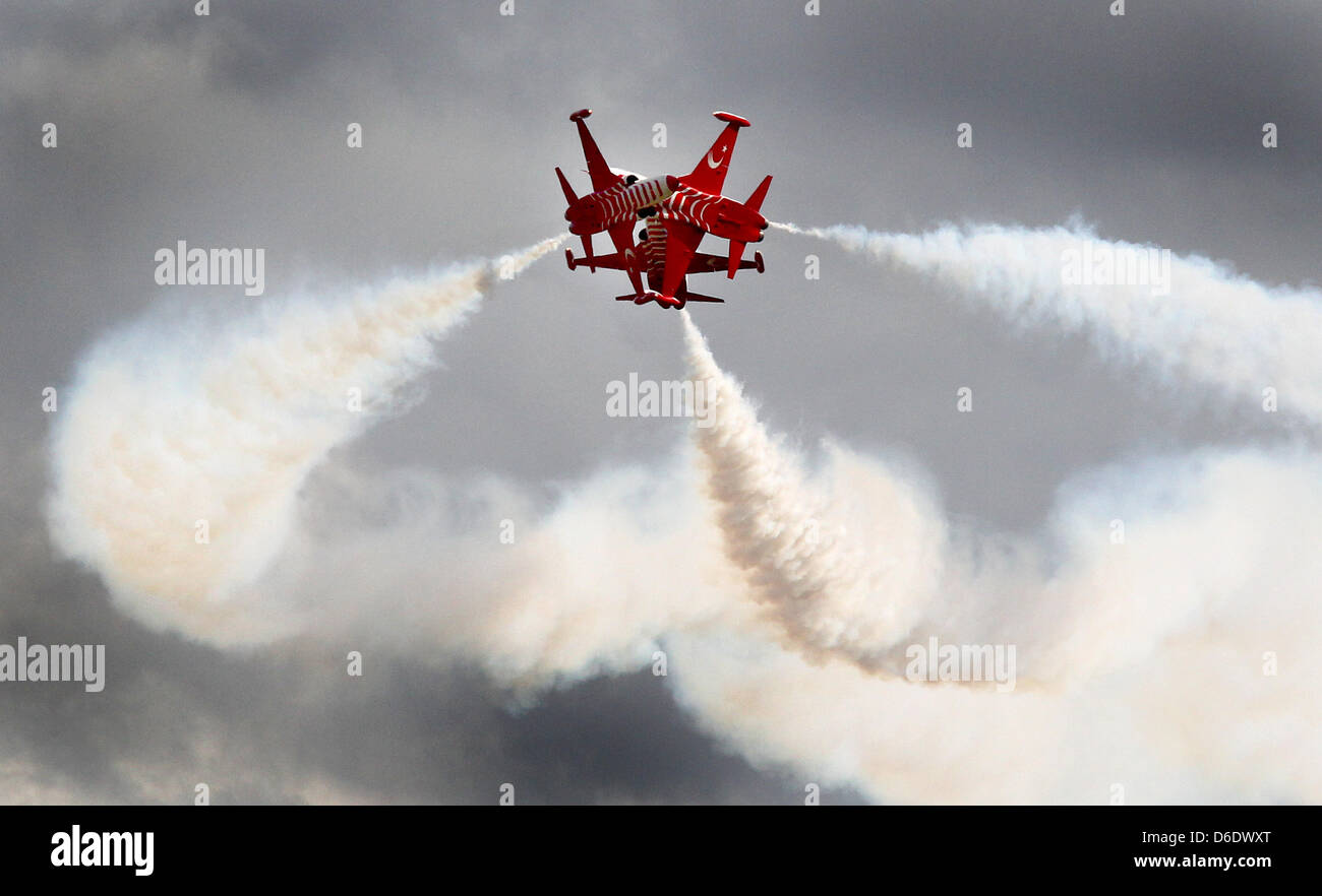 An aerial arobatic team from the Turkish Air Force perform during the ...