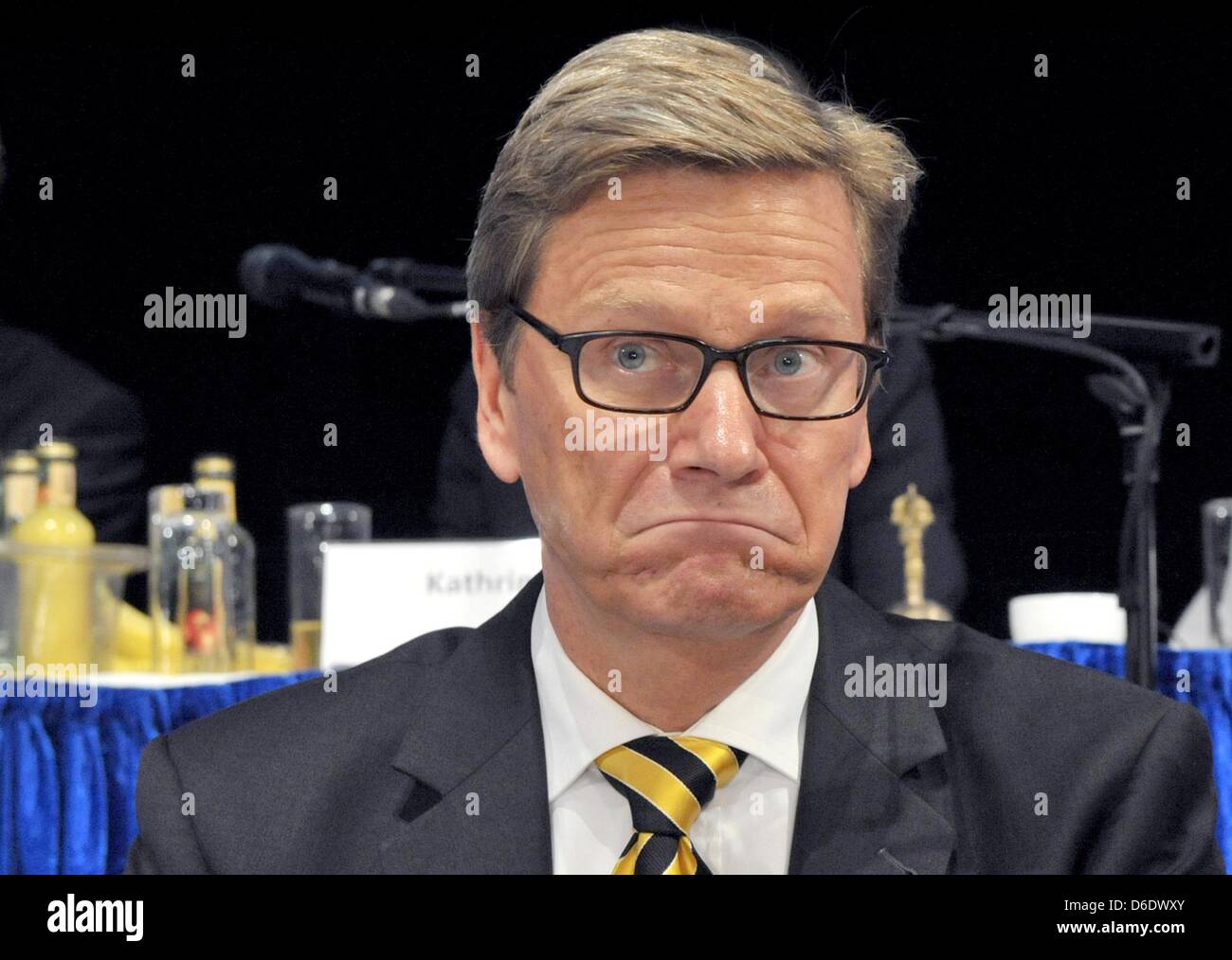 German Foreign Minister Guido Westerwelle sits on the podium during the ...