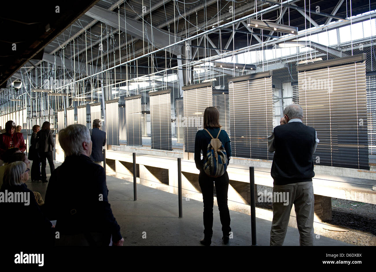 Documenta visitors view an installation by Haegue Yang at documenta (13 ...
