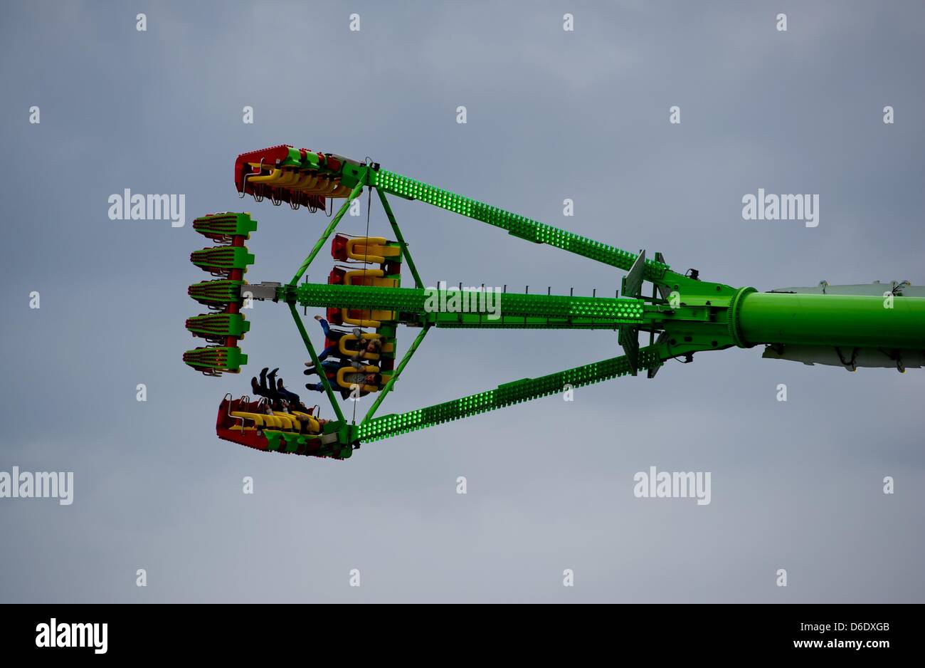 The amusement ride 'Konga' is silhouetted against the grey sky at ...