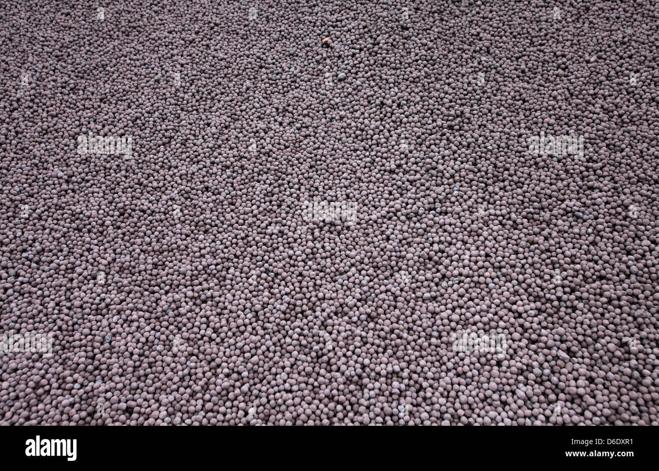 Iron ore pellets are piled up at the steel plant of the steel producing ...