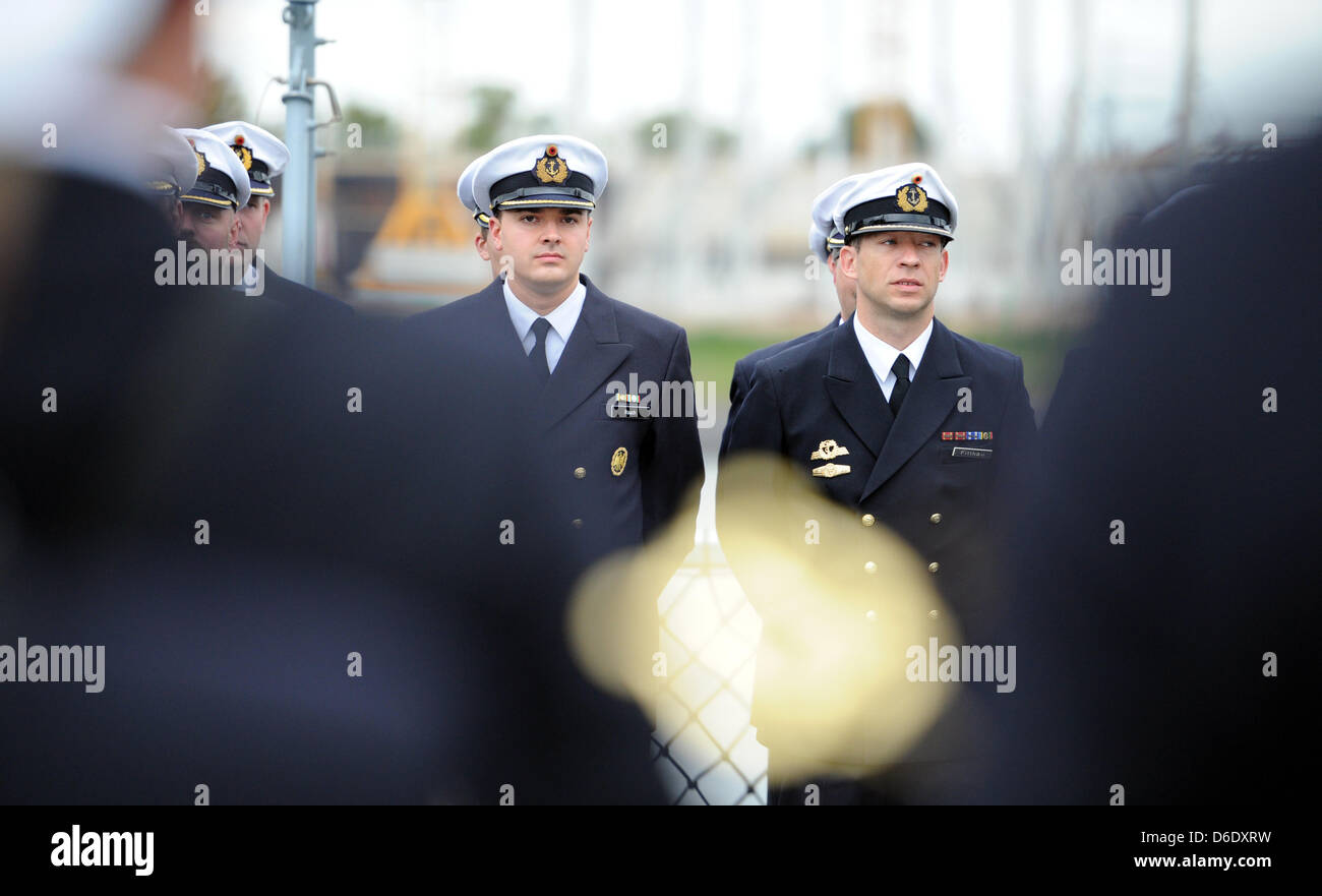 Crew members stand on deck of the frigate 'Hamburg' during the ...