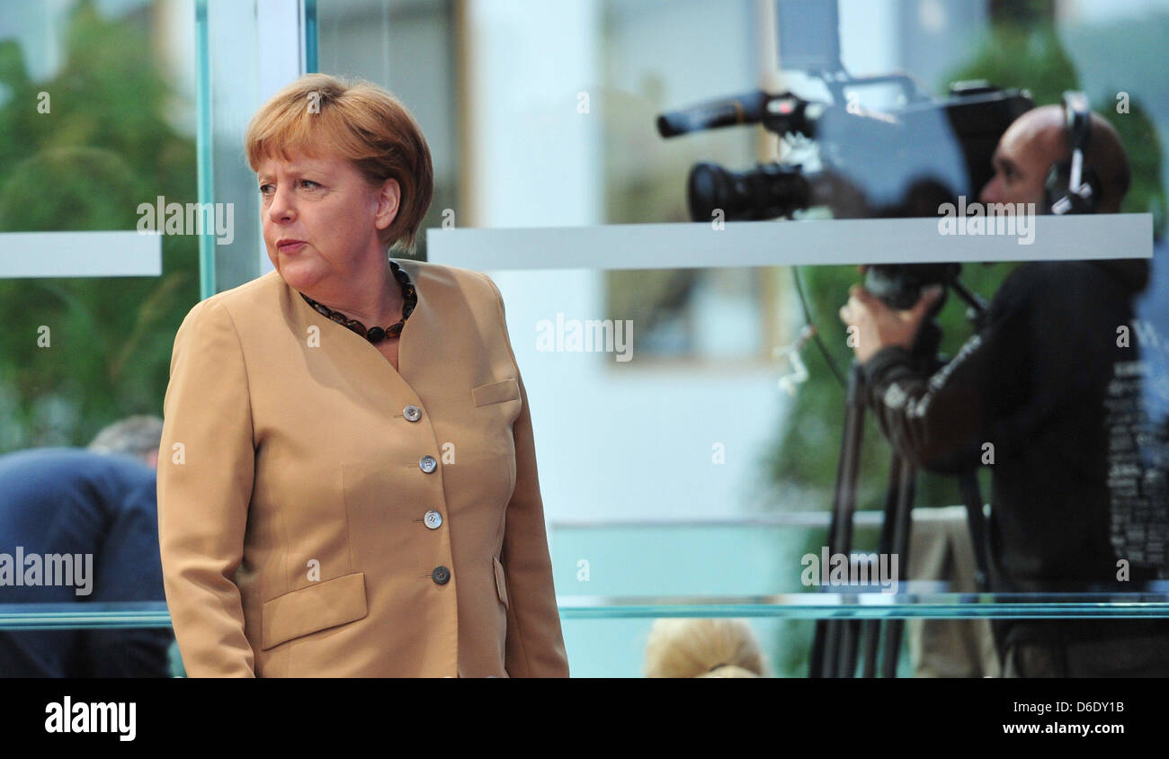 German Chancellor Angela Merkel arrives for a press conference on ...