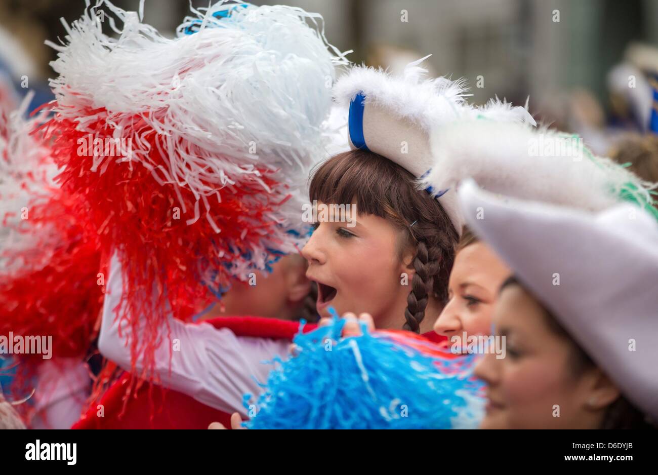 Female members of a carnival association dance in front of the city ...