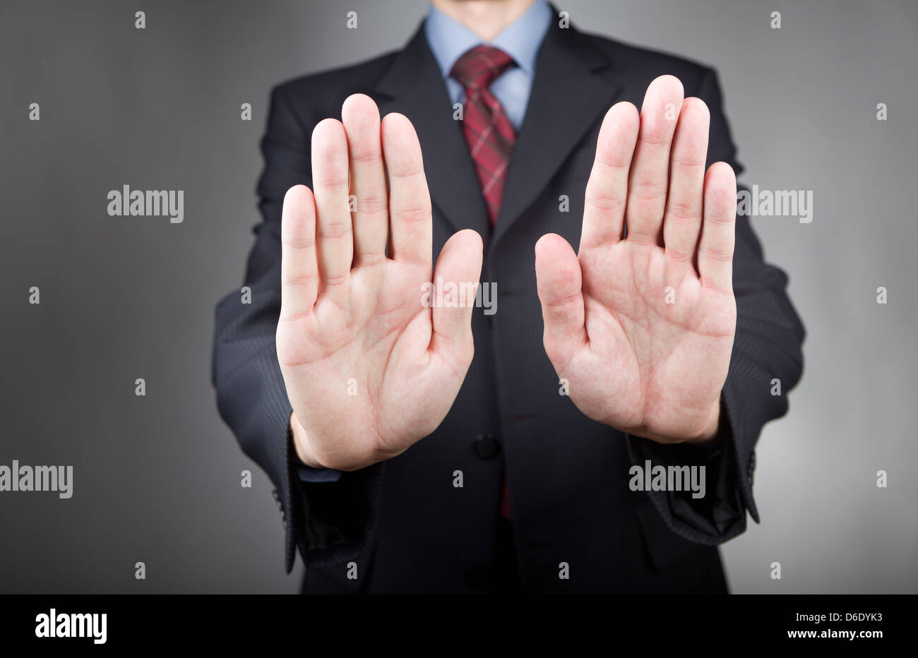 Businessman with stop hands sign Stock Photo - Alamy