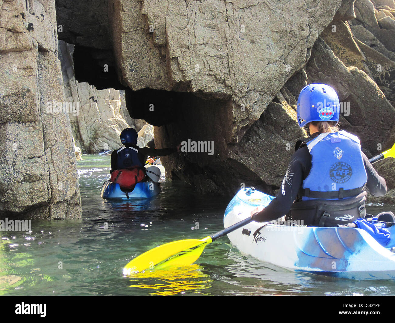People kayaking through caves in Wales Stock Photo - Alamy