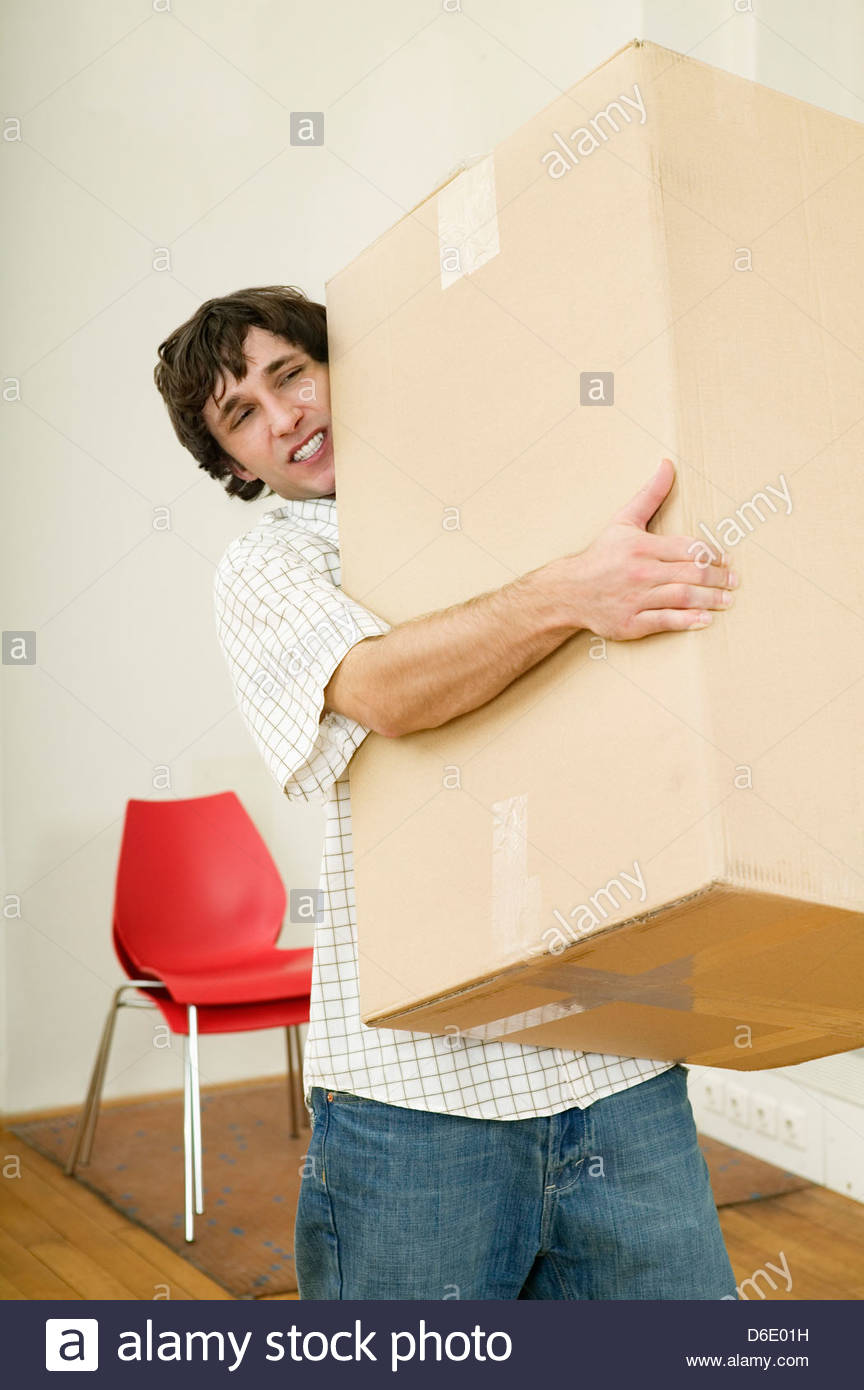 Carrying A Heavy Box High Resolution Stock Photography and Images - Alamy