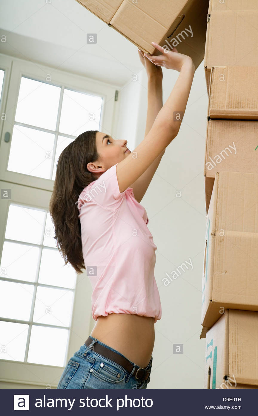 Woman Carrying Heavy Boxes High Resolution Stock Photography and Images ...