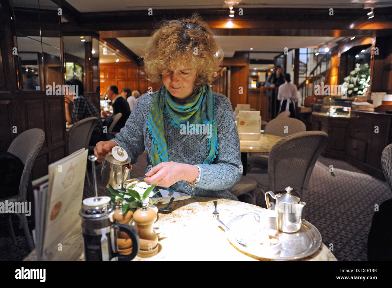 Woman enjoying afternoon tea hi-res stock photography and images - Alamy