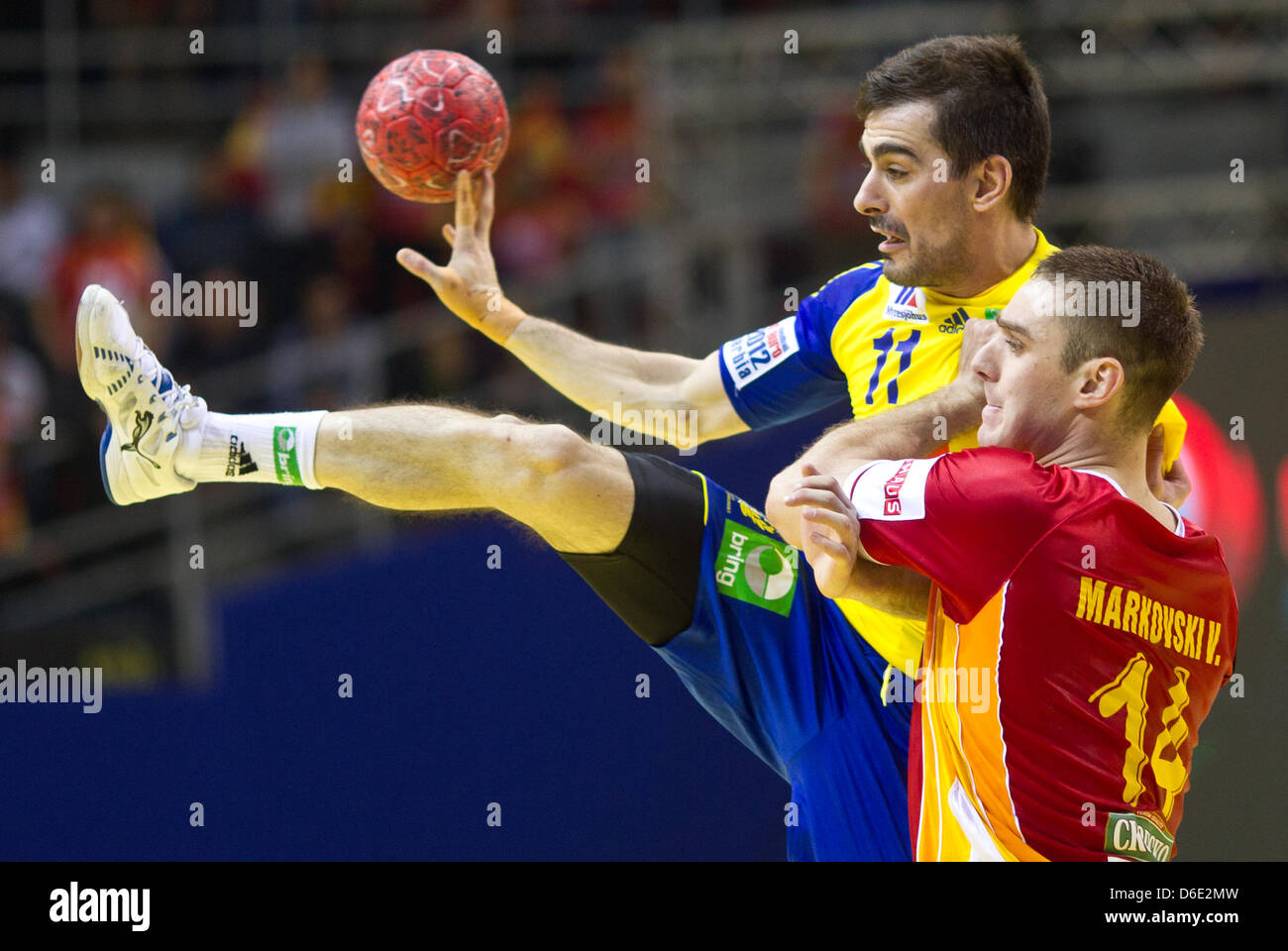 Sweden's Dalibor Doder (L) is attacked by Macedonia's Velko Markoski (R ...