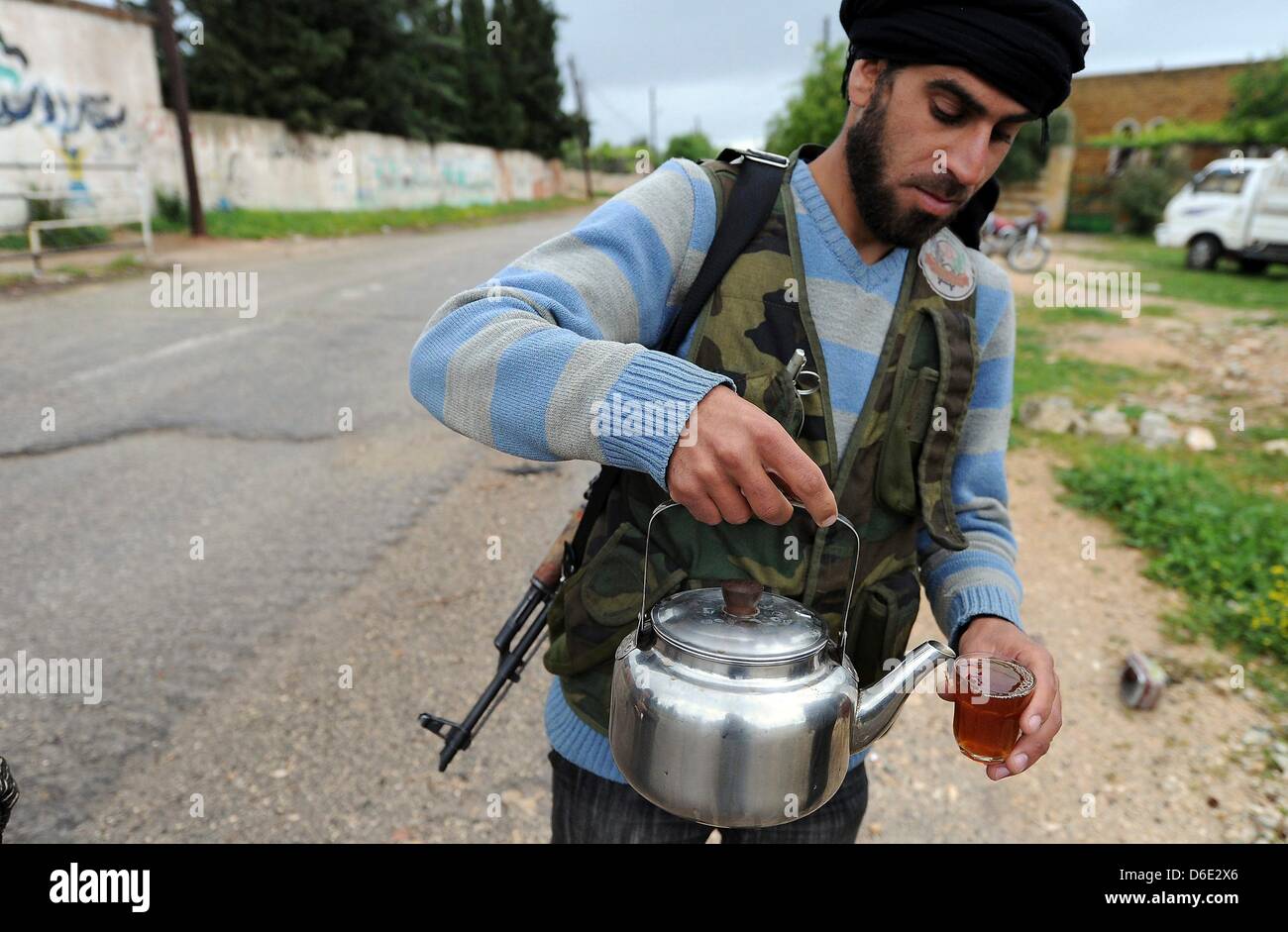 DARKOUSH, SYRIA: A Free Syrian Army soldier pouring tea on April 16 ...