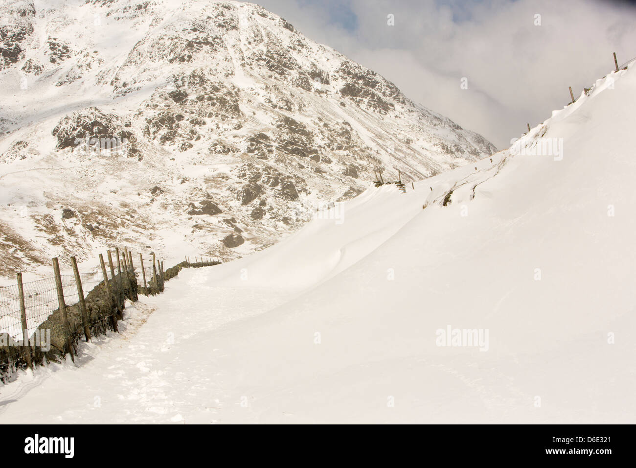 Massive snow drifts block the Kirkstone Pass road above Ambleside in ...