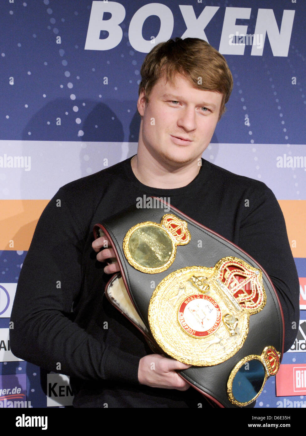 Heavyweight boxer Alexander Povetki poses for a picture with his WBA ...