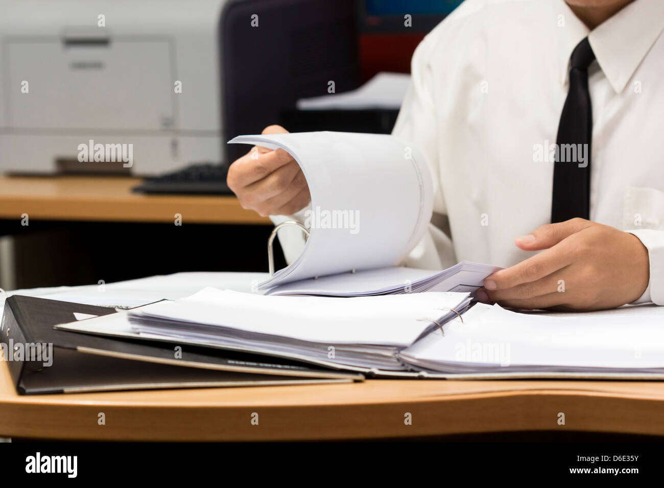 businessman search paper from file Stock Photo - Alamy